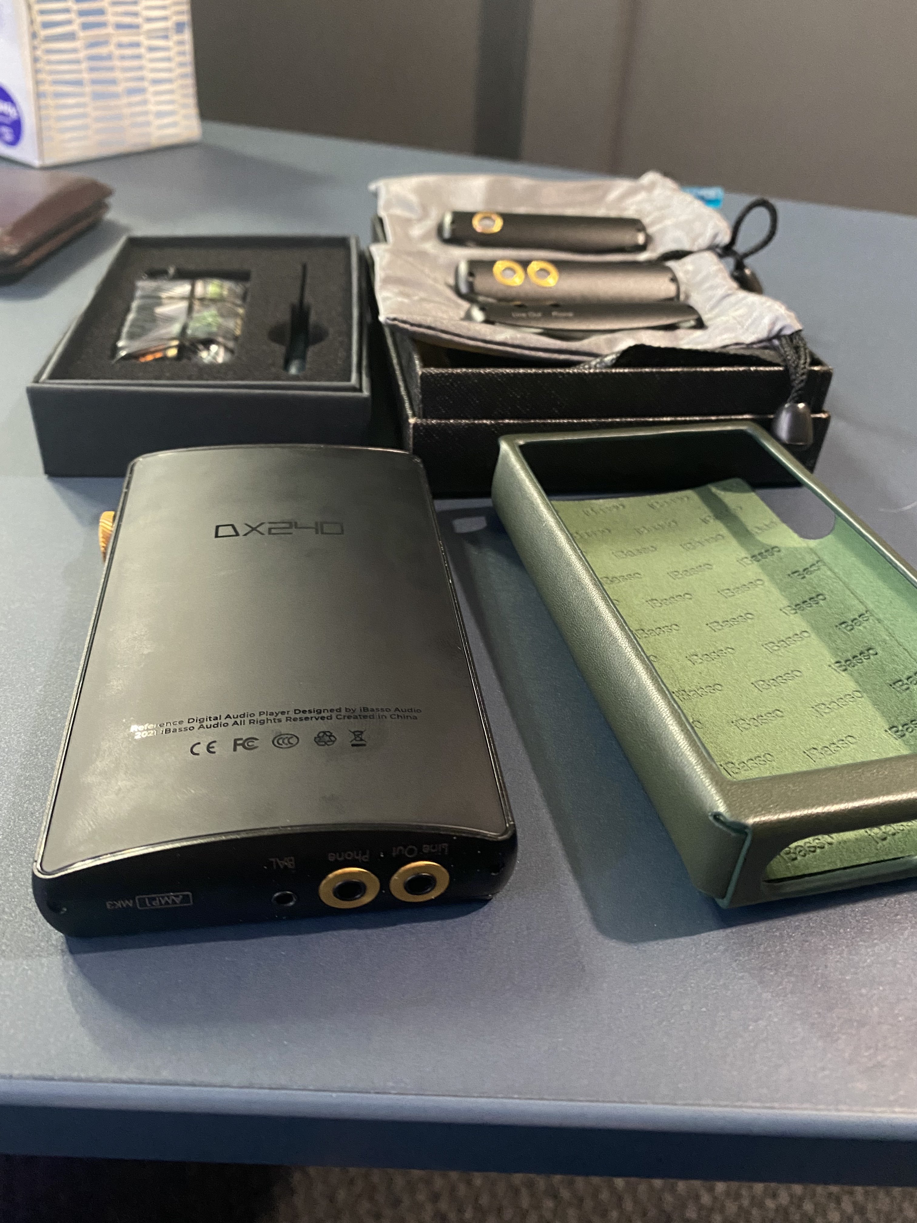 Closed: iBasso DX240 with green leather case, amp faceplates, and ...